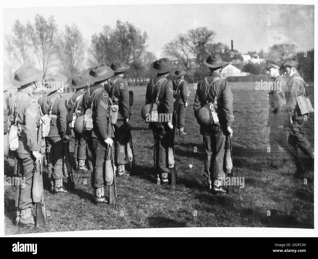 The King inspects Australian troops during a formal visit, reviewing ...