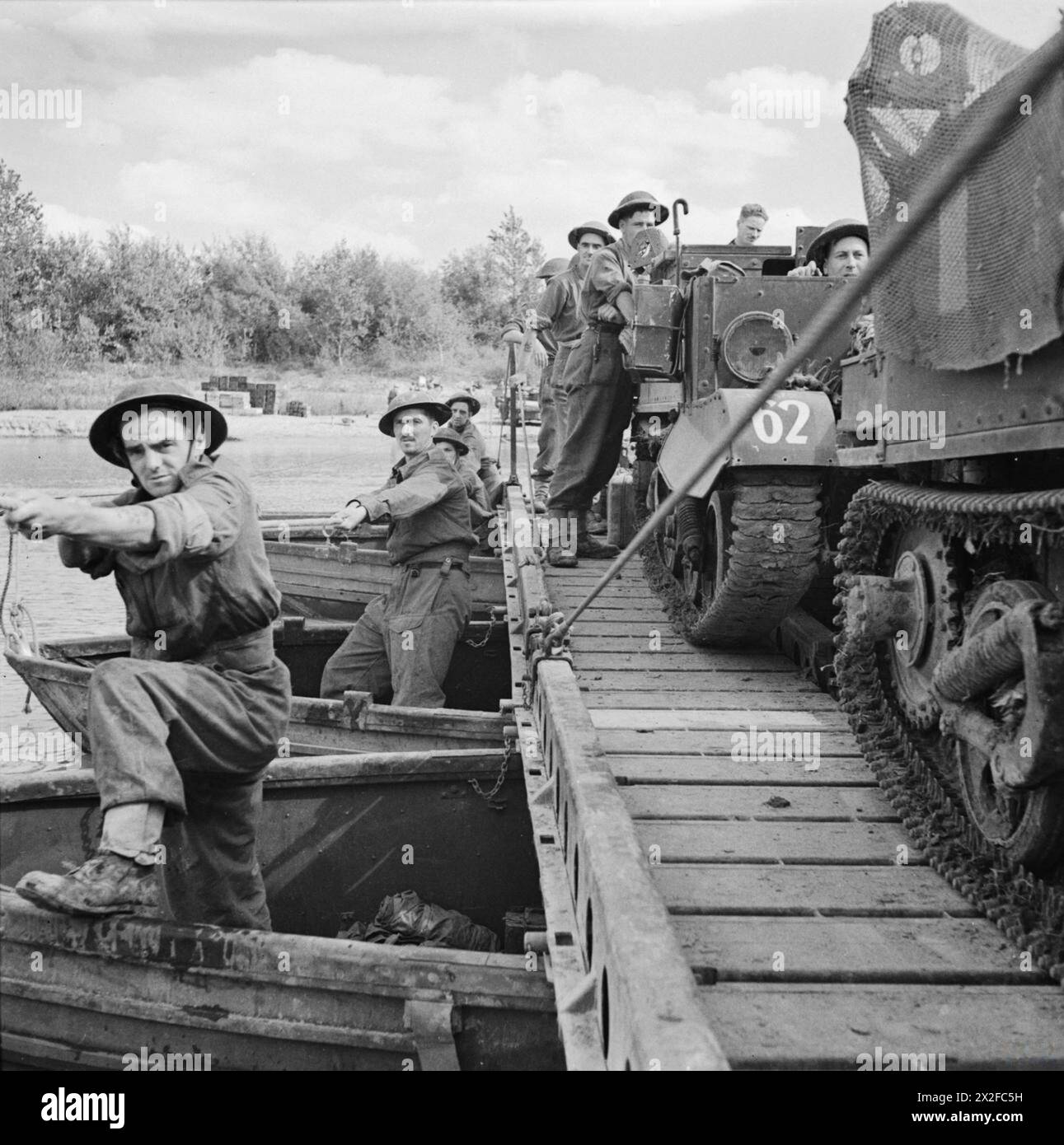 THE BRITISH ARMY IN ITALY 1943 - A raft loaded with Universal carriers ...
