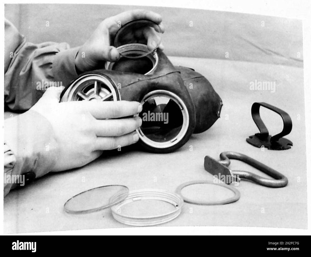 A British Army soldier adjusts the eye piece disc on a standard army ...