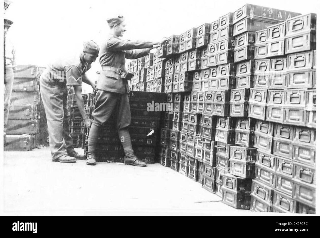 WITH THE BRITISH AIR FORCE IN GREECE - A Greek soldier lends a hand to ...