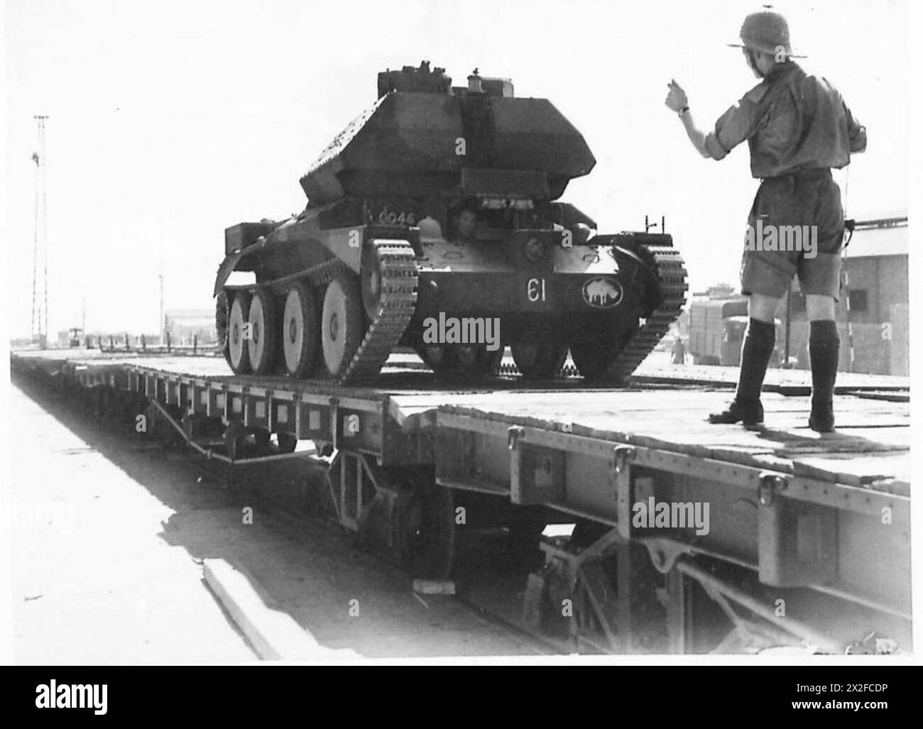 British Cruiser Mk IV tanks are unloaded from ships and loaded onto ...