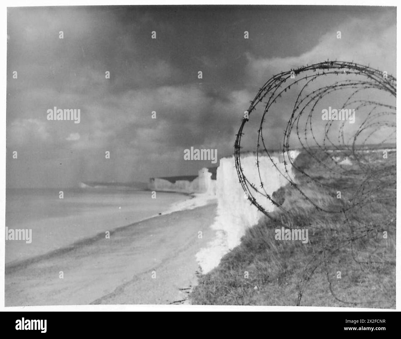 Barbed wire entanglements are installed on cliffs as part of British ...