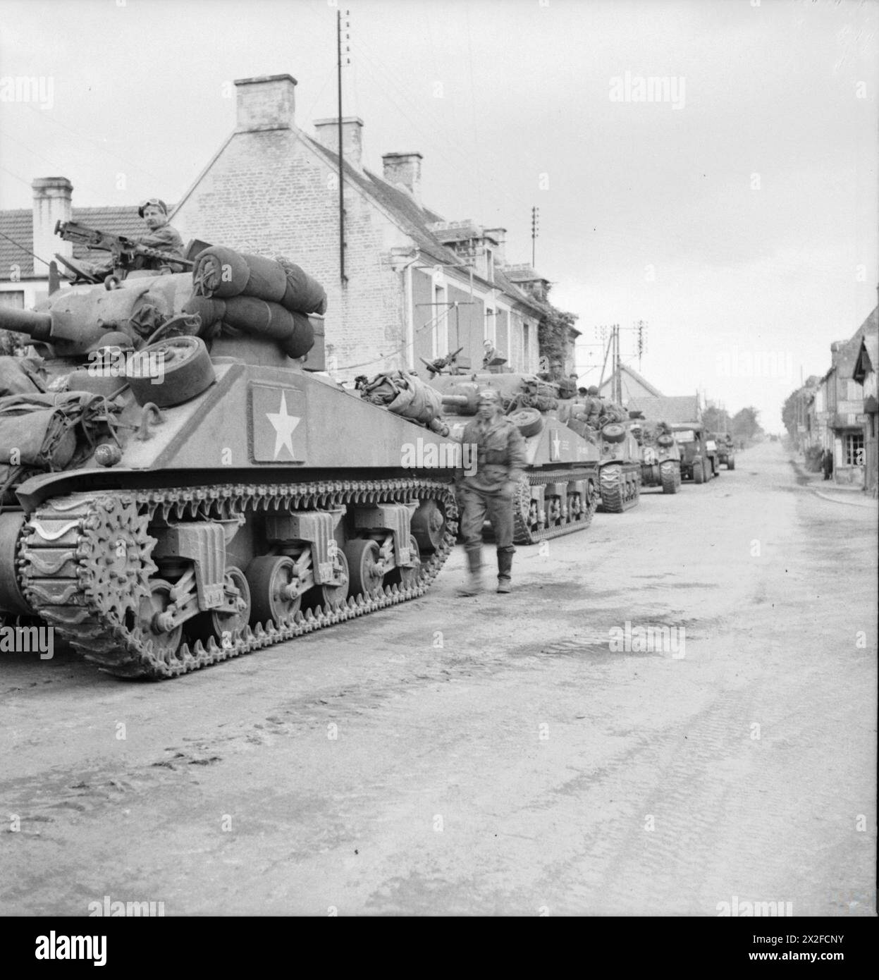 THE BRITISH ARMY IN NORMANDY 1944 - Sherman tanks lined up in the ...