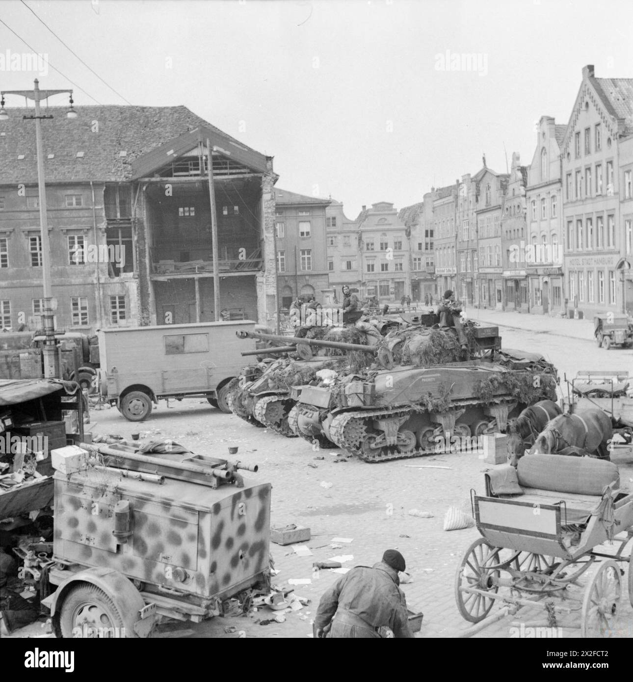 Sherman tanks of the Royal Scots Greys, 4th Armoured Brigade, are ...