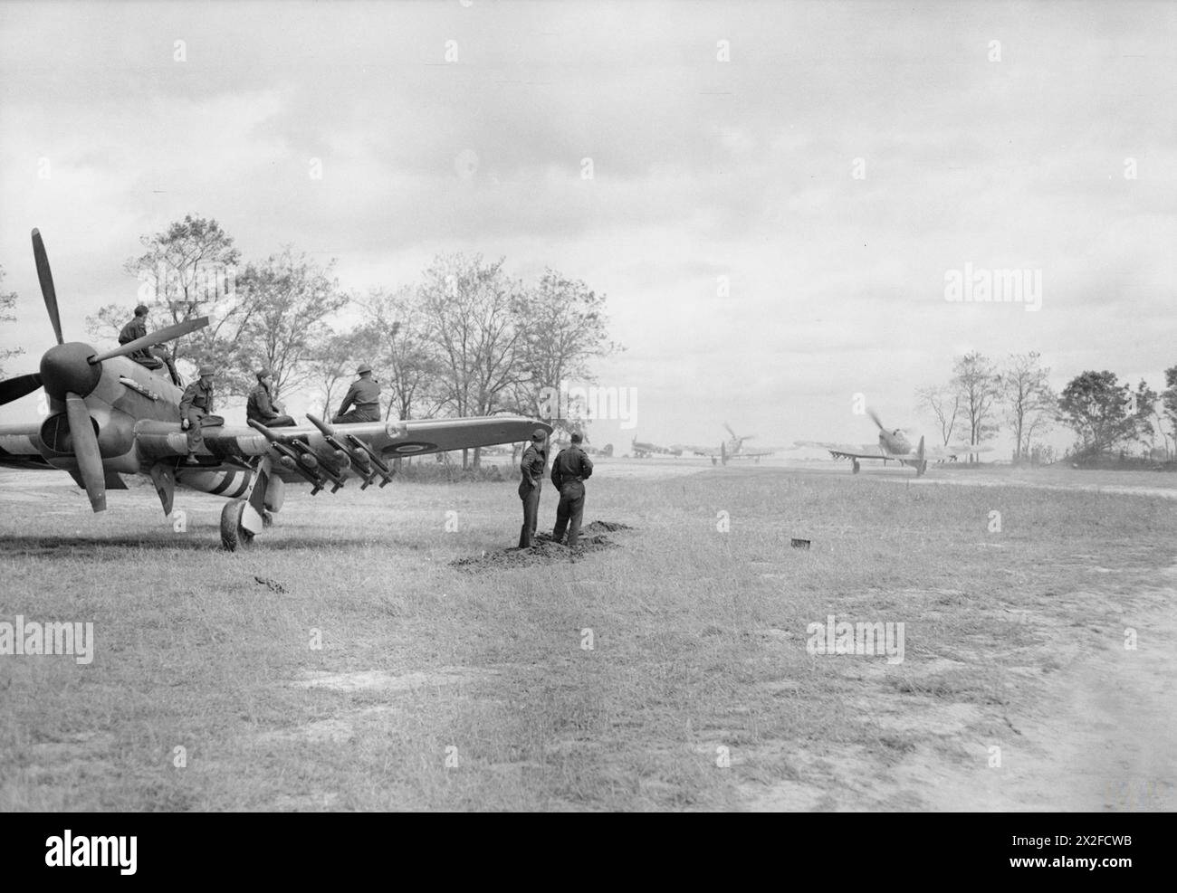 Ground crew of No. 175 Squadron RAF watch Hawker Typhoon Mark IB ...