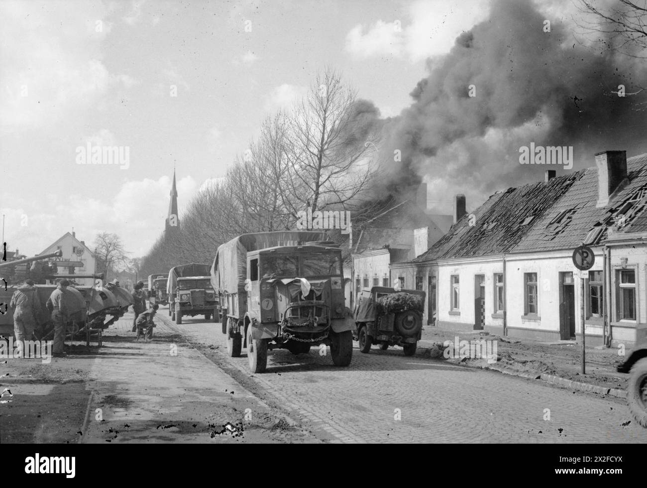 THE BRITISH ARMY IN NORTH-WEST EUROPE 1944-45 - Supply lorries pass ...