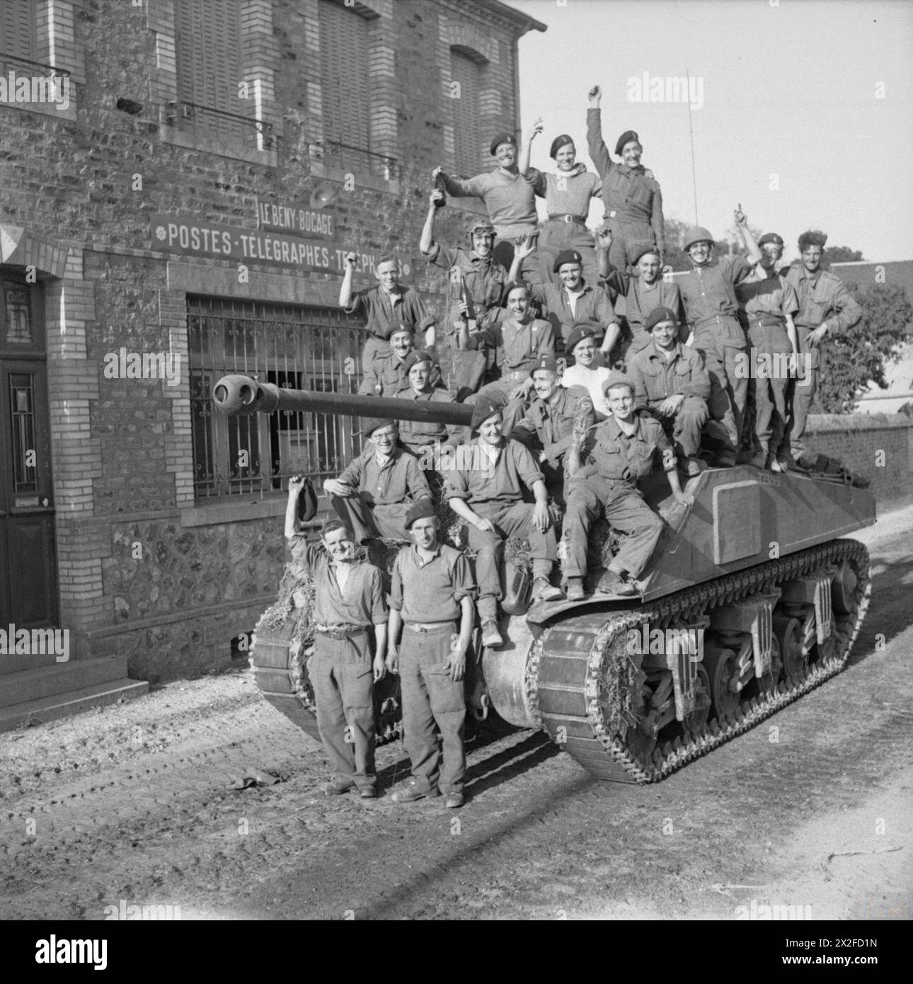 British Army tank crews climb onto a Sherman Firefly to mark the ...