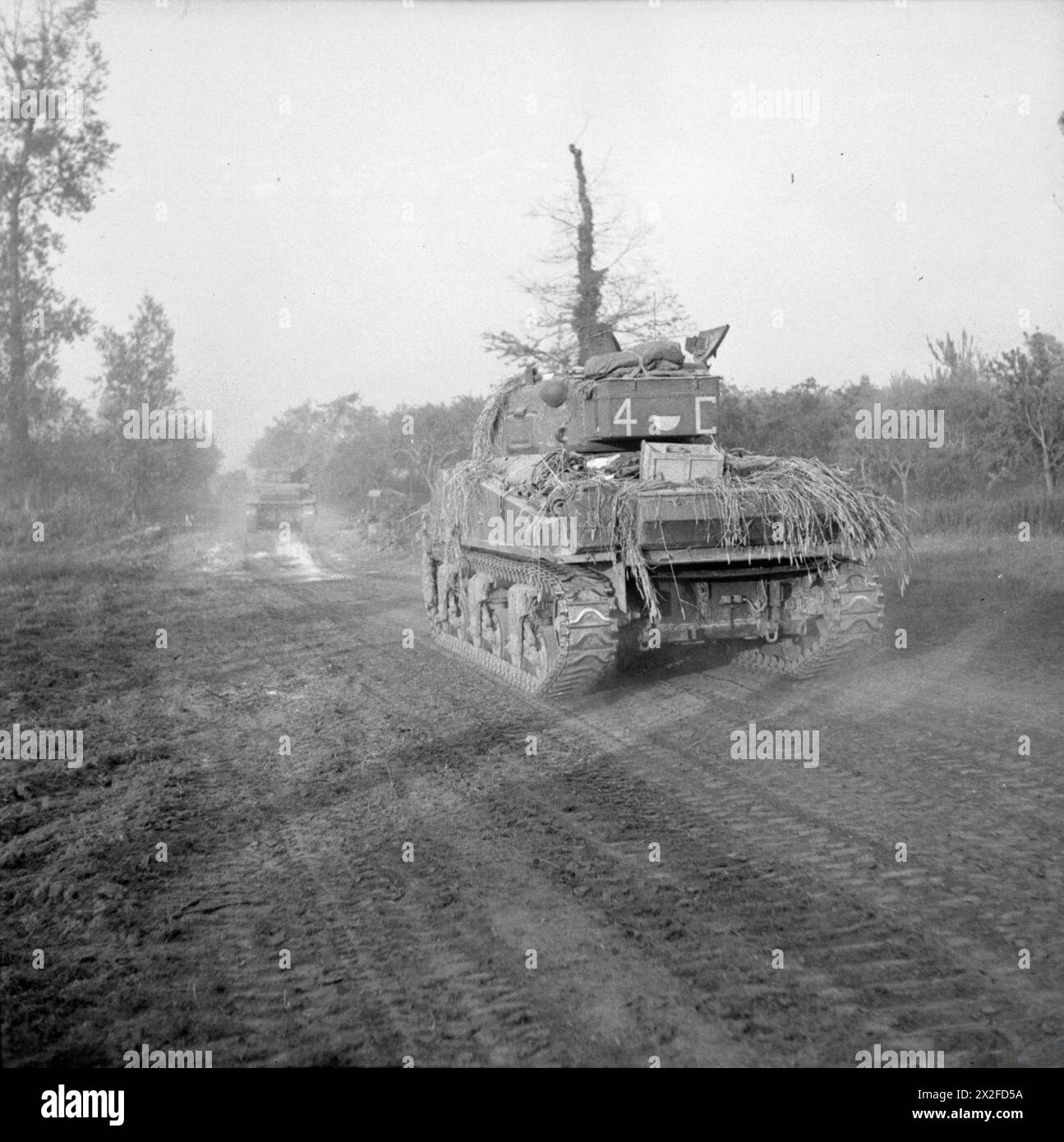 Sherman tanks of the British Army advance to the battle area during ...