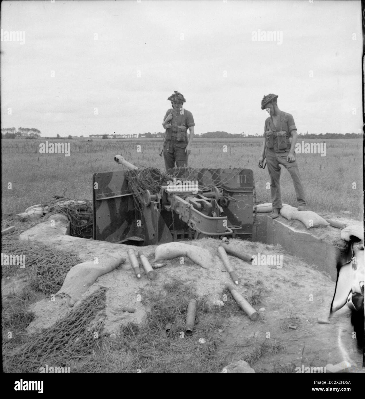THE BRITISH ARMY IN NORMANDY 1944 - Troops examine an abandoned German ...
