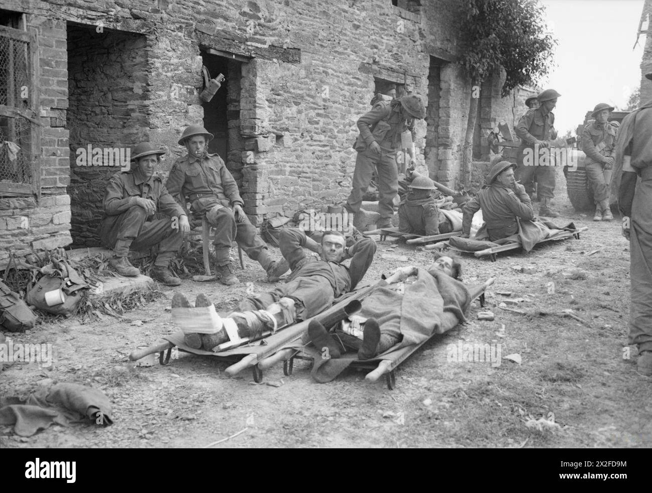 THE BRITISH ARMY IN NORMANDY 1944 - German and British wounded await ...