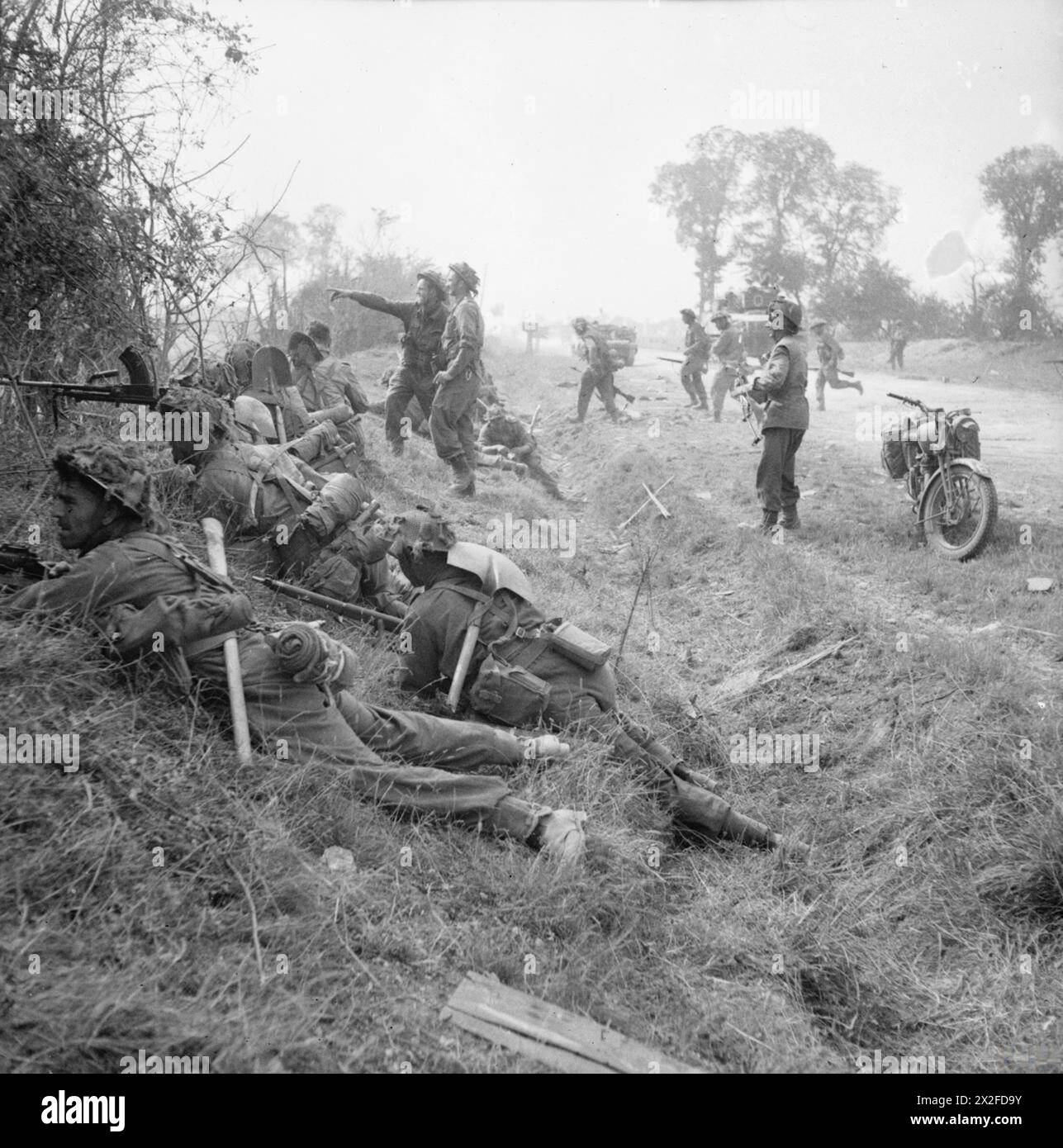 Soldiers of the 1st Welsh Guards engage in action near Cagny during ...