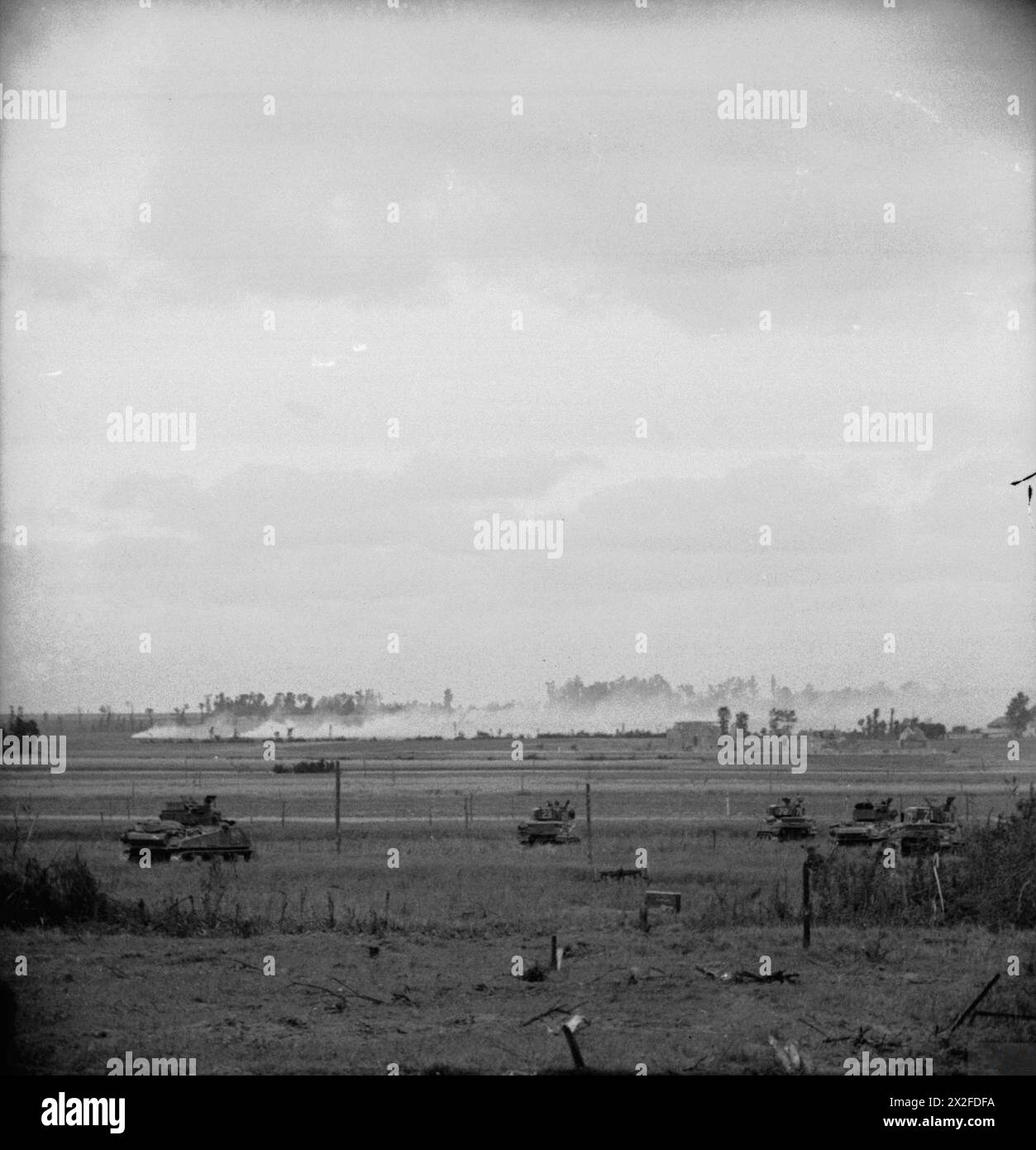 THE BRITISH ARMY IN NORMANDY 1944 - Sherman tanks advance towards Epron ...