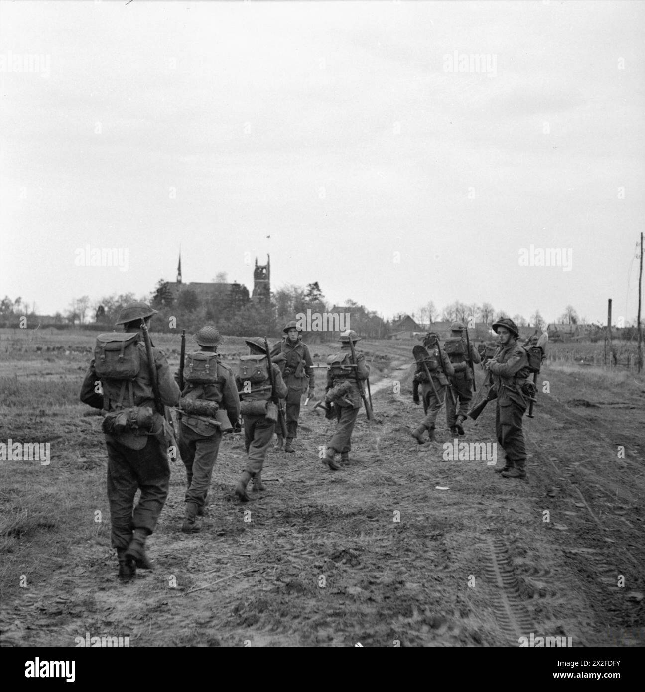 Troops of the 8th Royal Scots advance into Moostdijk on 6 November 1944 ...