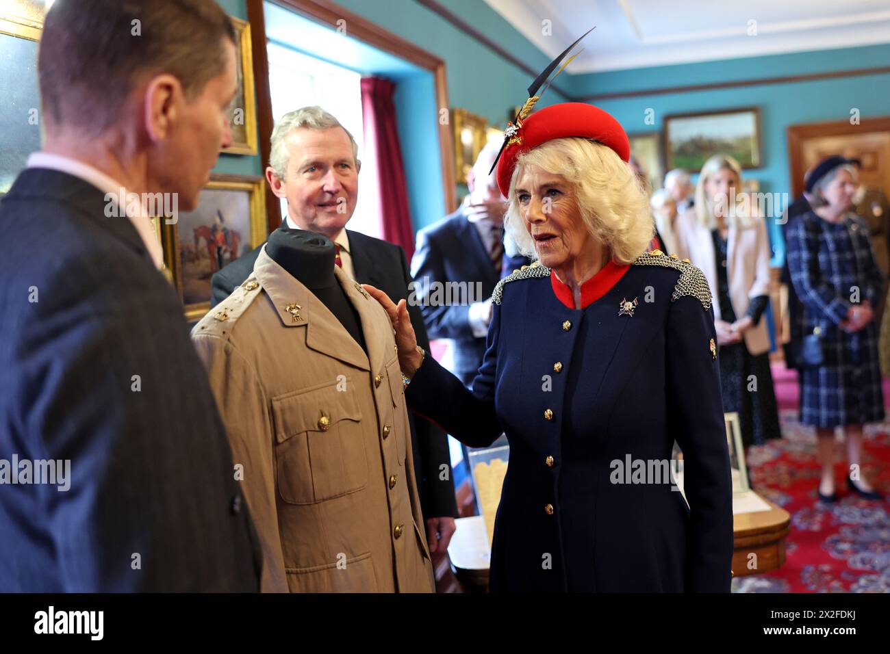 Queen camilla views the tunic belonging to her late father major bruce ...