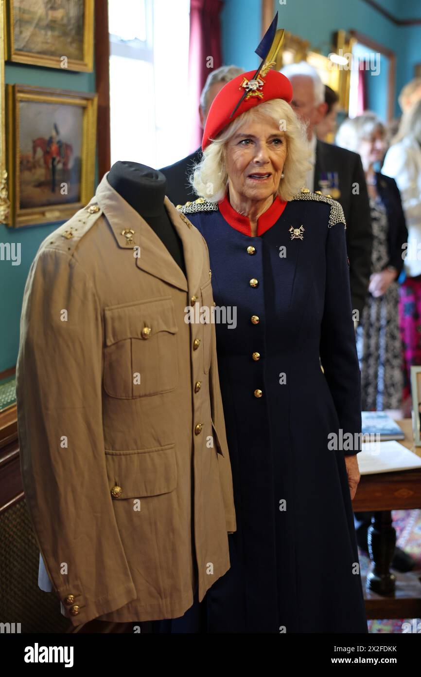 Queen camilla views the tunic belonging to her late father major bruce ...