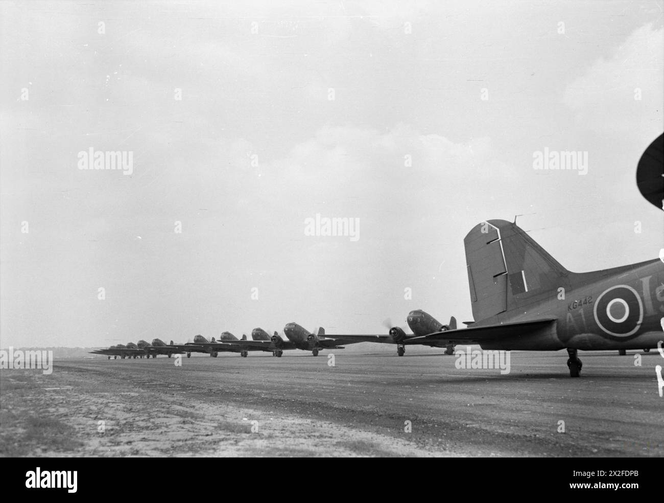Douglas Dakota Mark II aircraft of No. 575 Squadron RAF taxi at ...