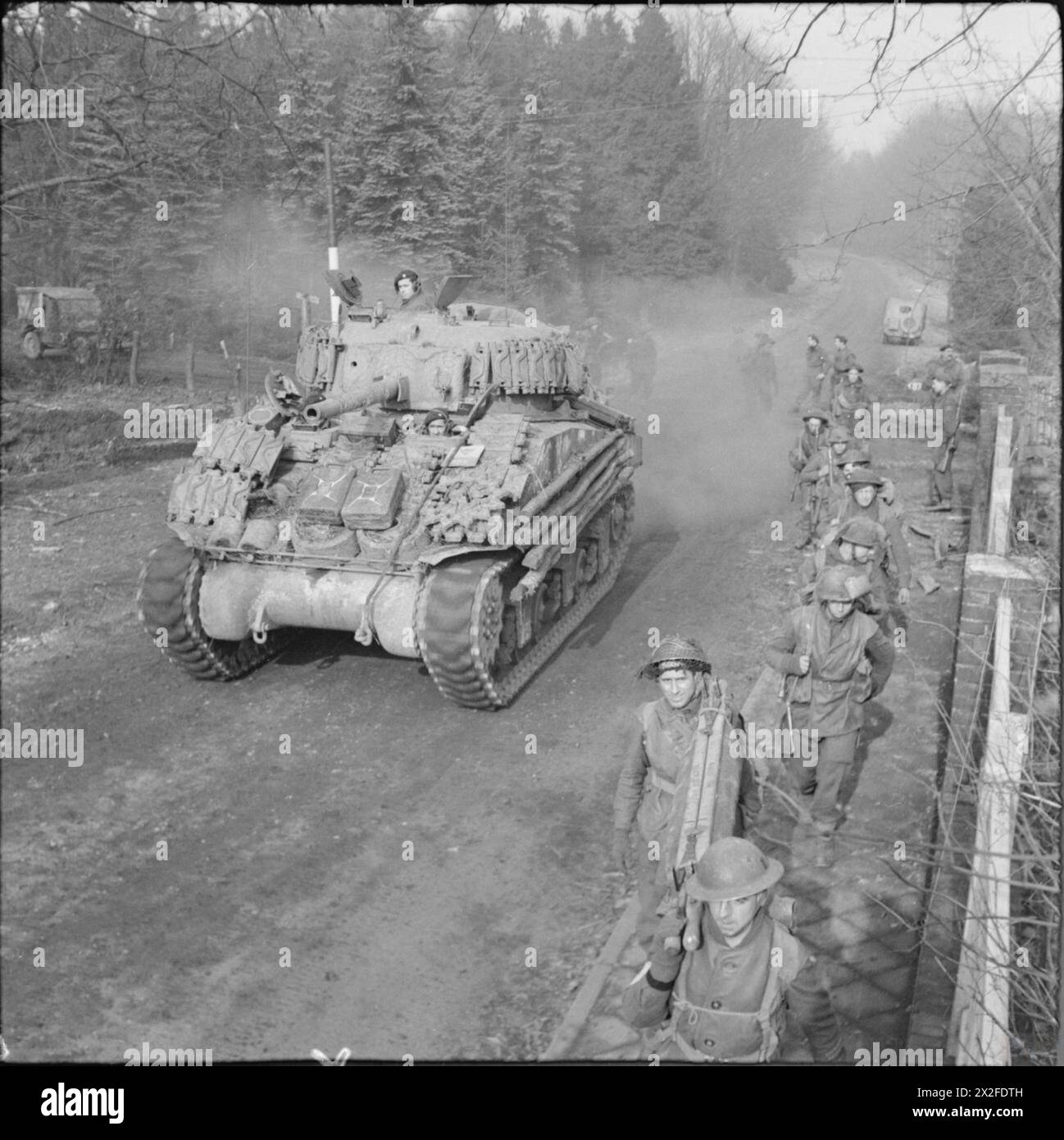 THE BRITISH ARMY IN NORTH-WEST EUROPE 1944-1945 - A Sherman tank passes ...