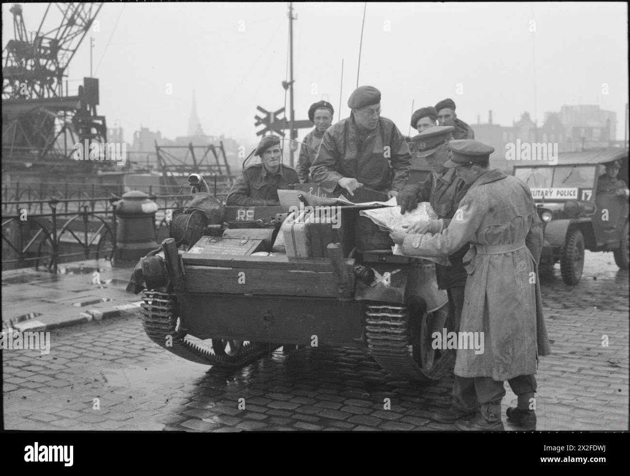 Lieutenant-General Brian Horrocks of 30 Corps studies maps with ...