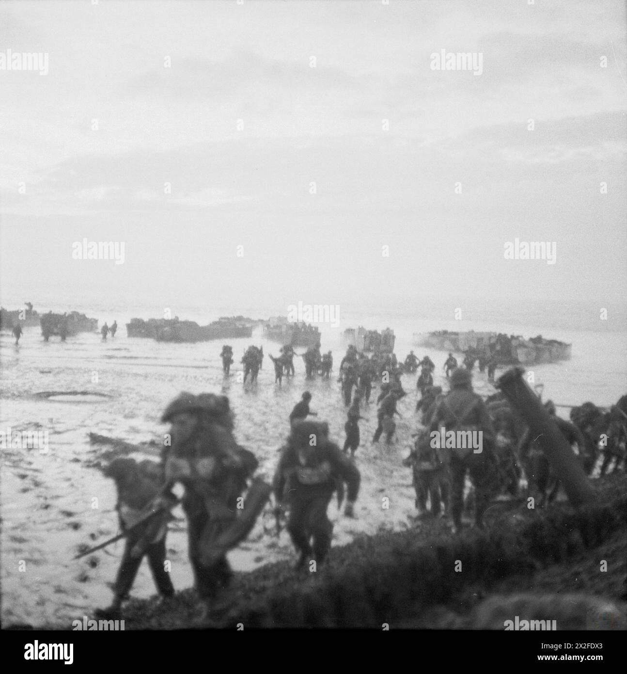 Men of the 4th Special Service Brigade waded ashore from landing craft ...