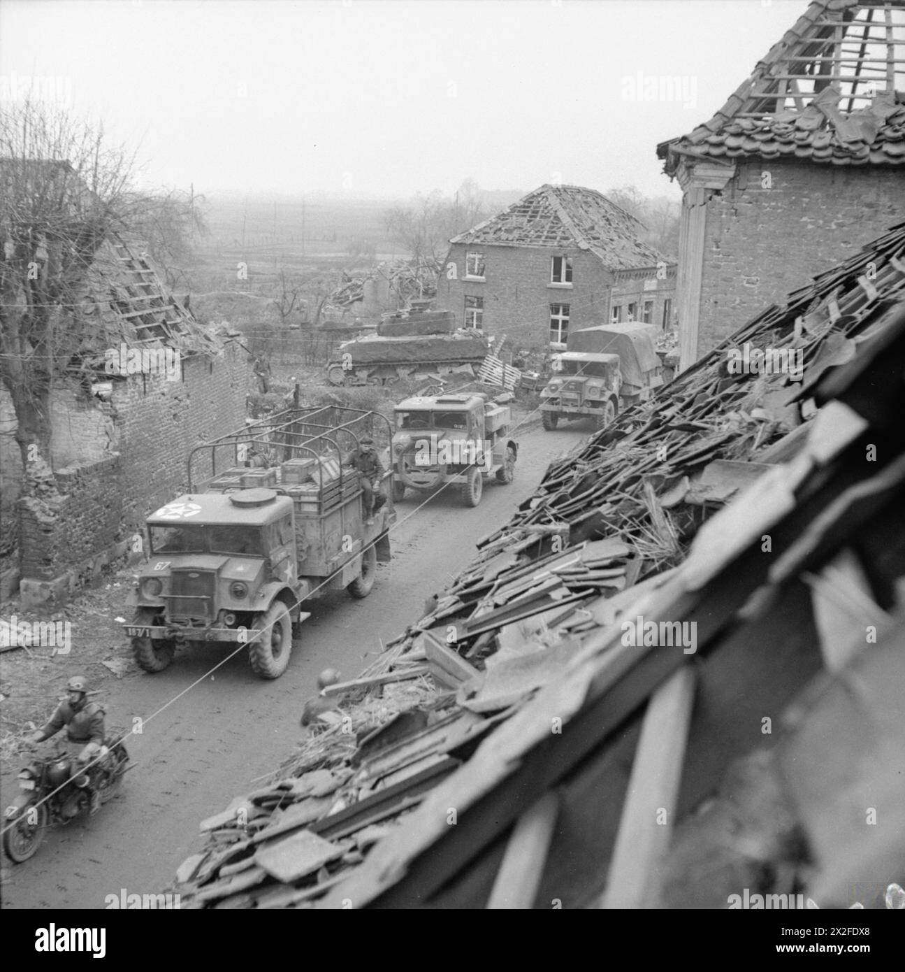 THE BRITISH ARMY IN NORTH-WEST EUROPE 1944-1945 - CMP lorries passing ...