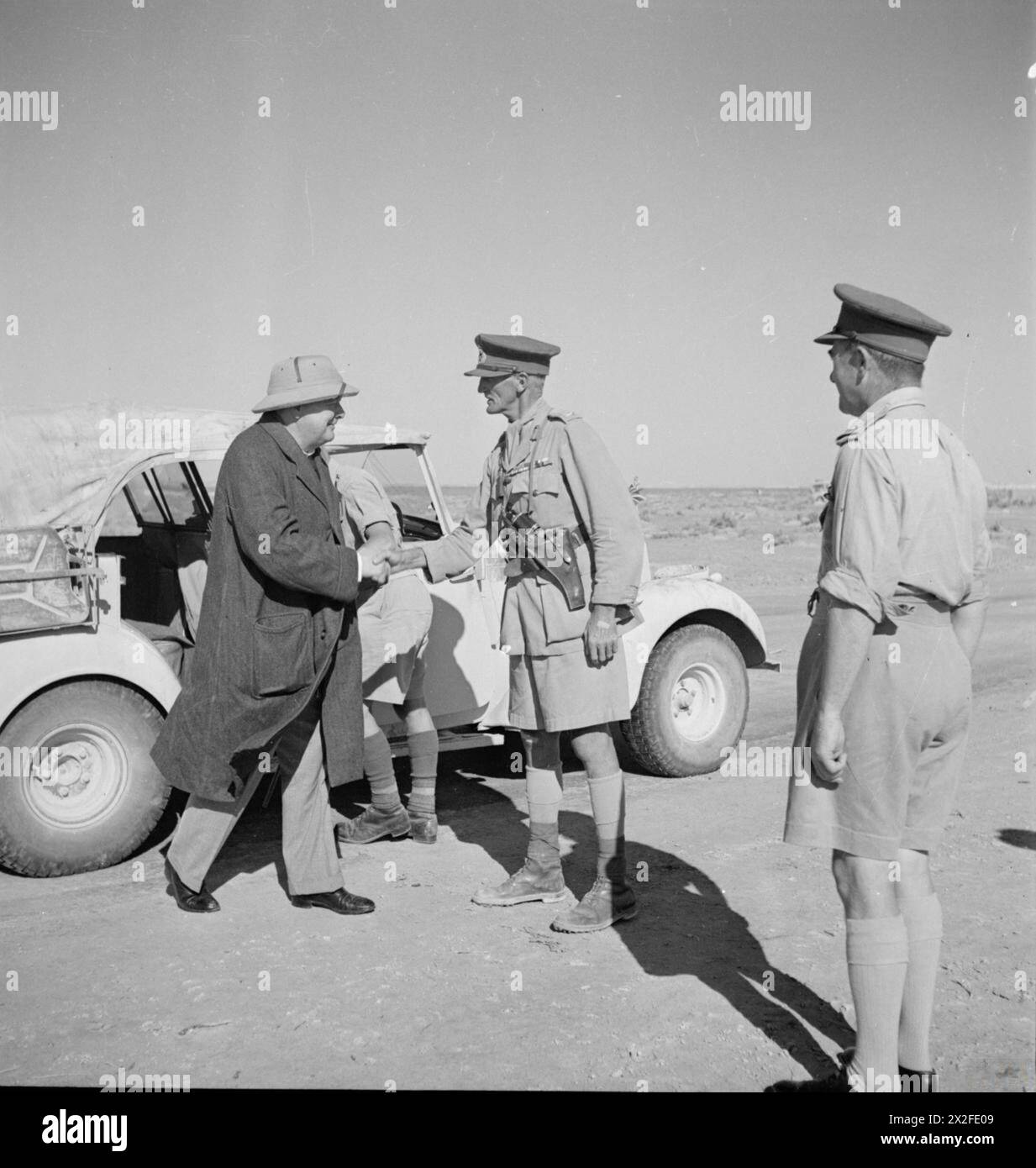 Winston Churchill shakes hands with Lieutenant General Ramsden ...