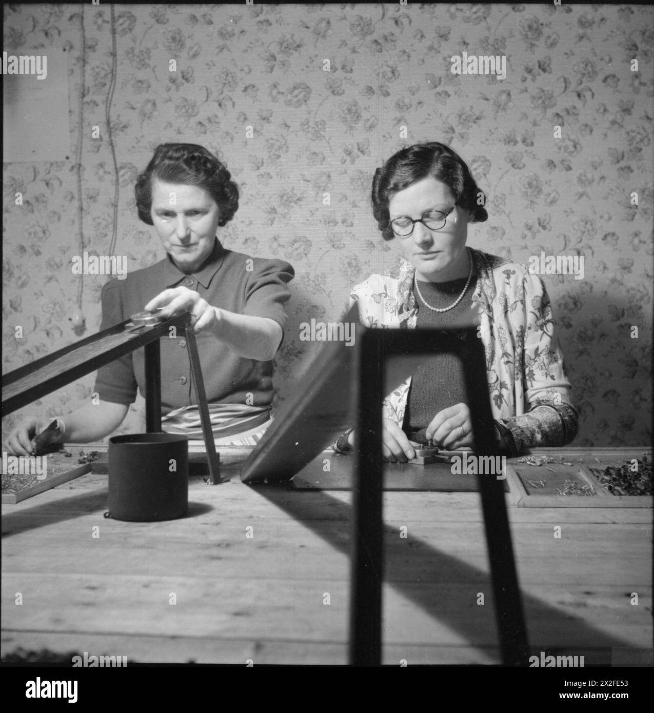 Mrs Dixon and Mrs Cook assemble springs in a temporary factory set up ...