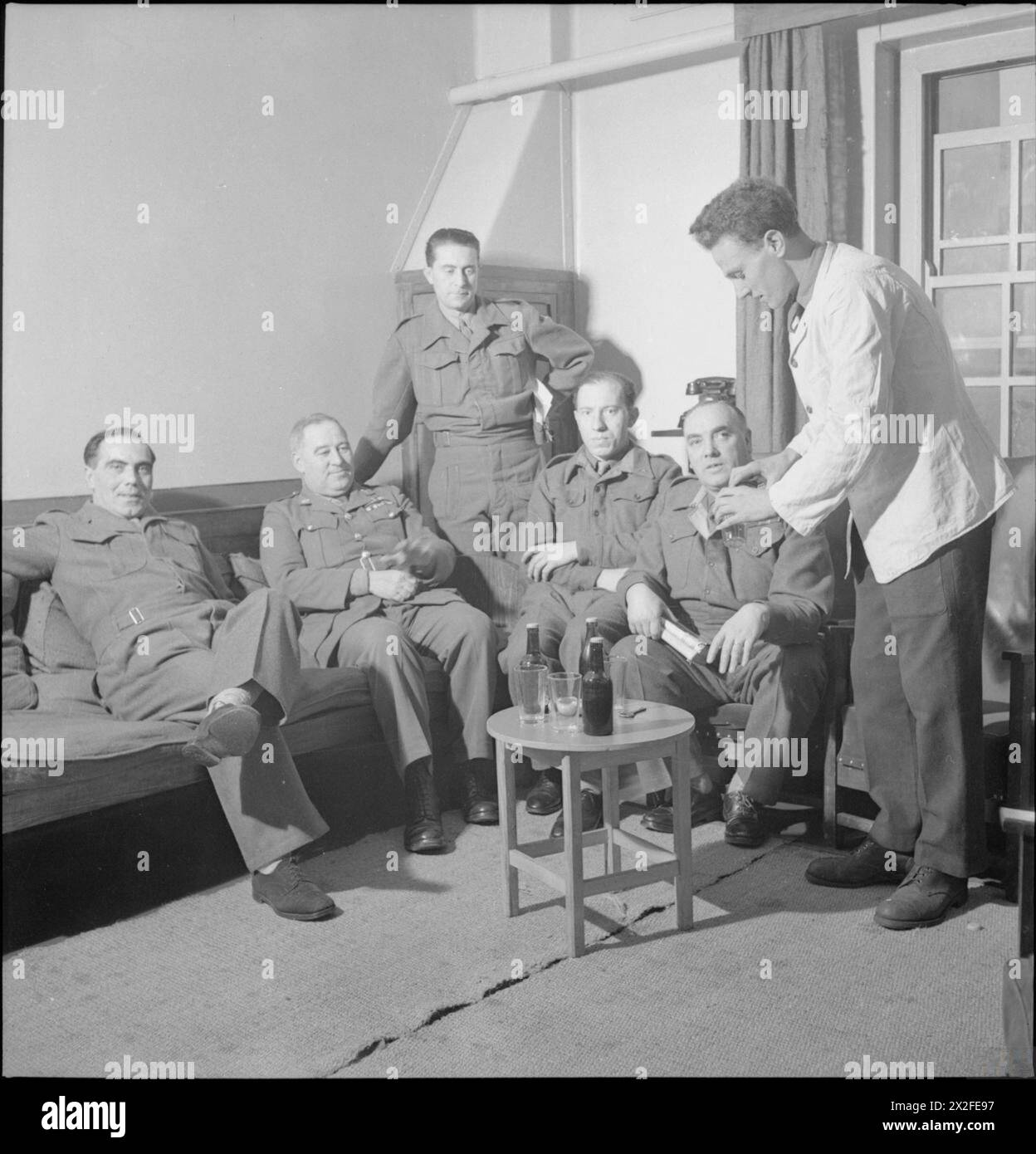 Members of the Italian POW General Staff relax at N.144 camp near ...