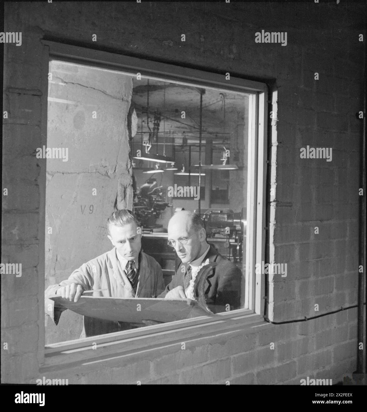 In 1942, shop superintendent Charles Tunstall gives instructions to a ...