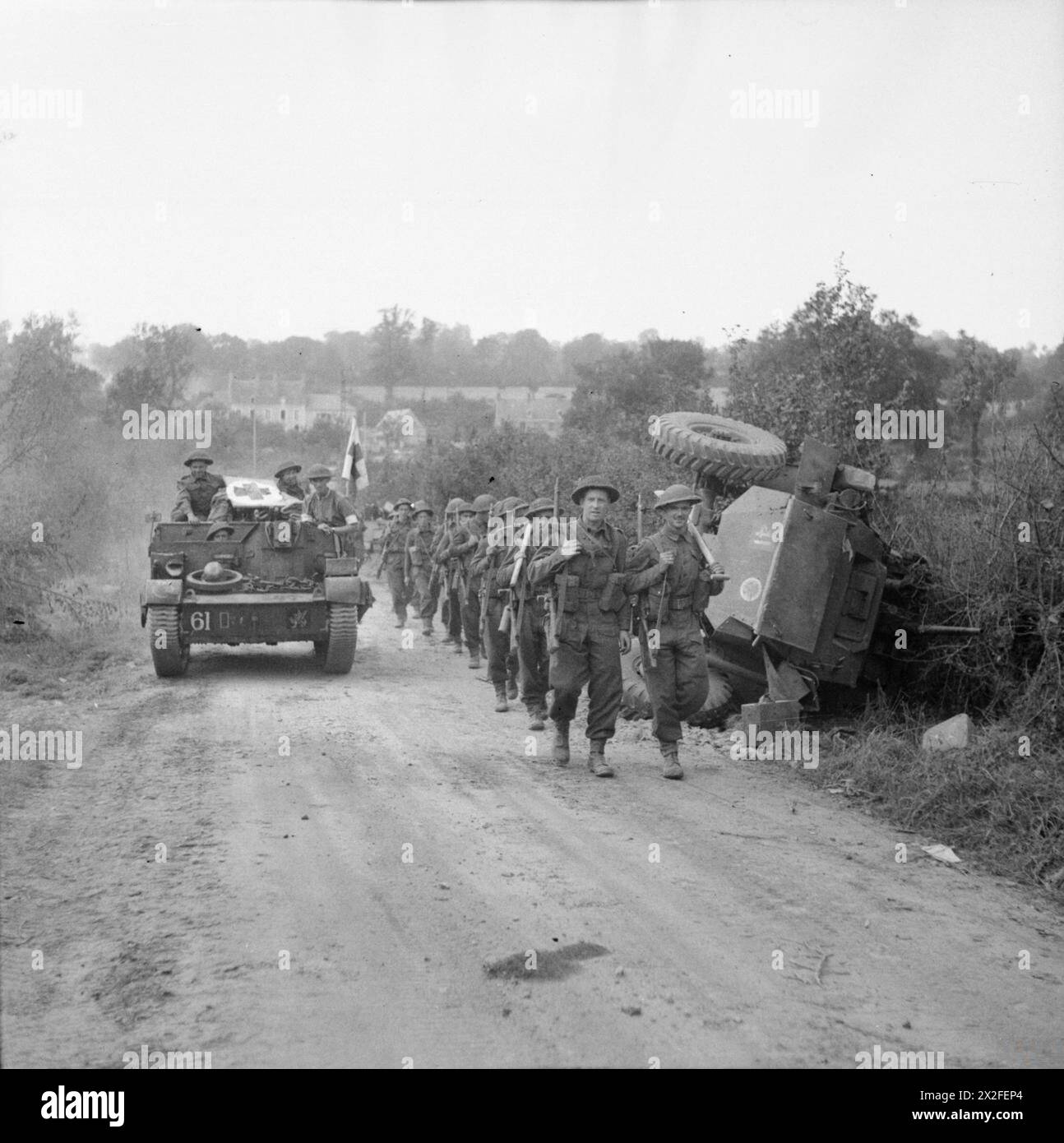 THE BRITISH ARMY IN NORMANDY 1944 - An ambulance carrier and troops ...