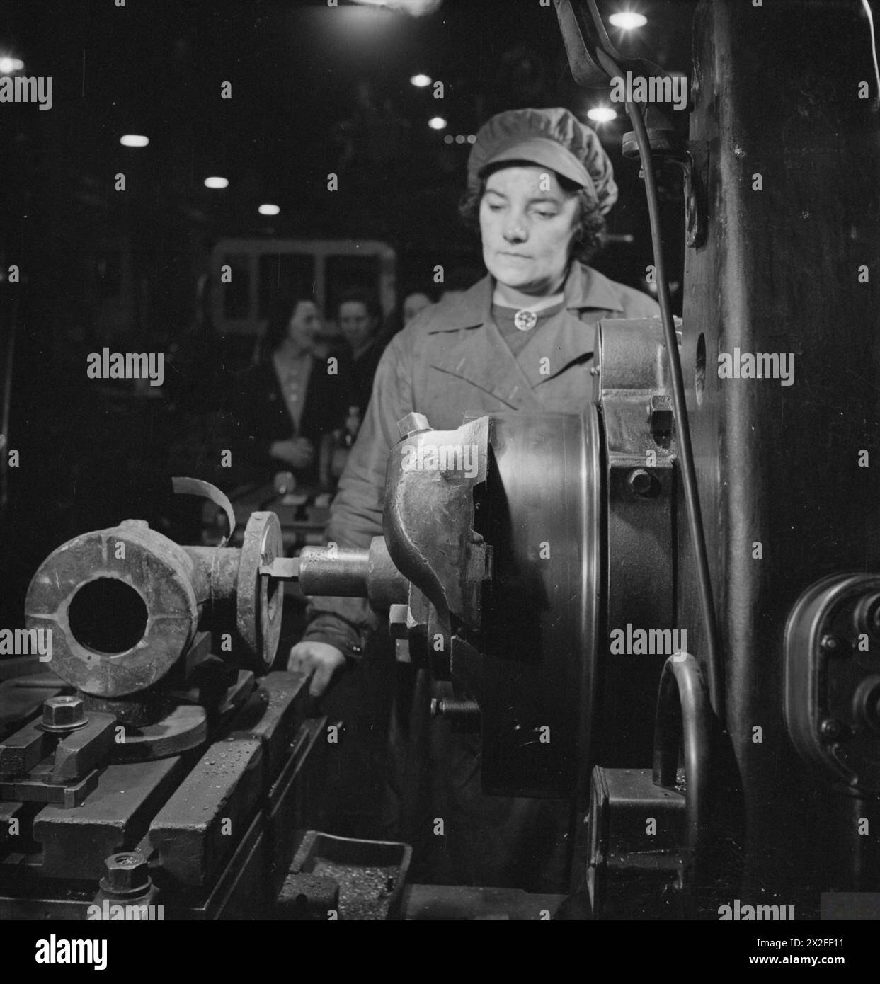 A female metal worker operates a Pearn-Richards Horizontal Boring Mill ...