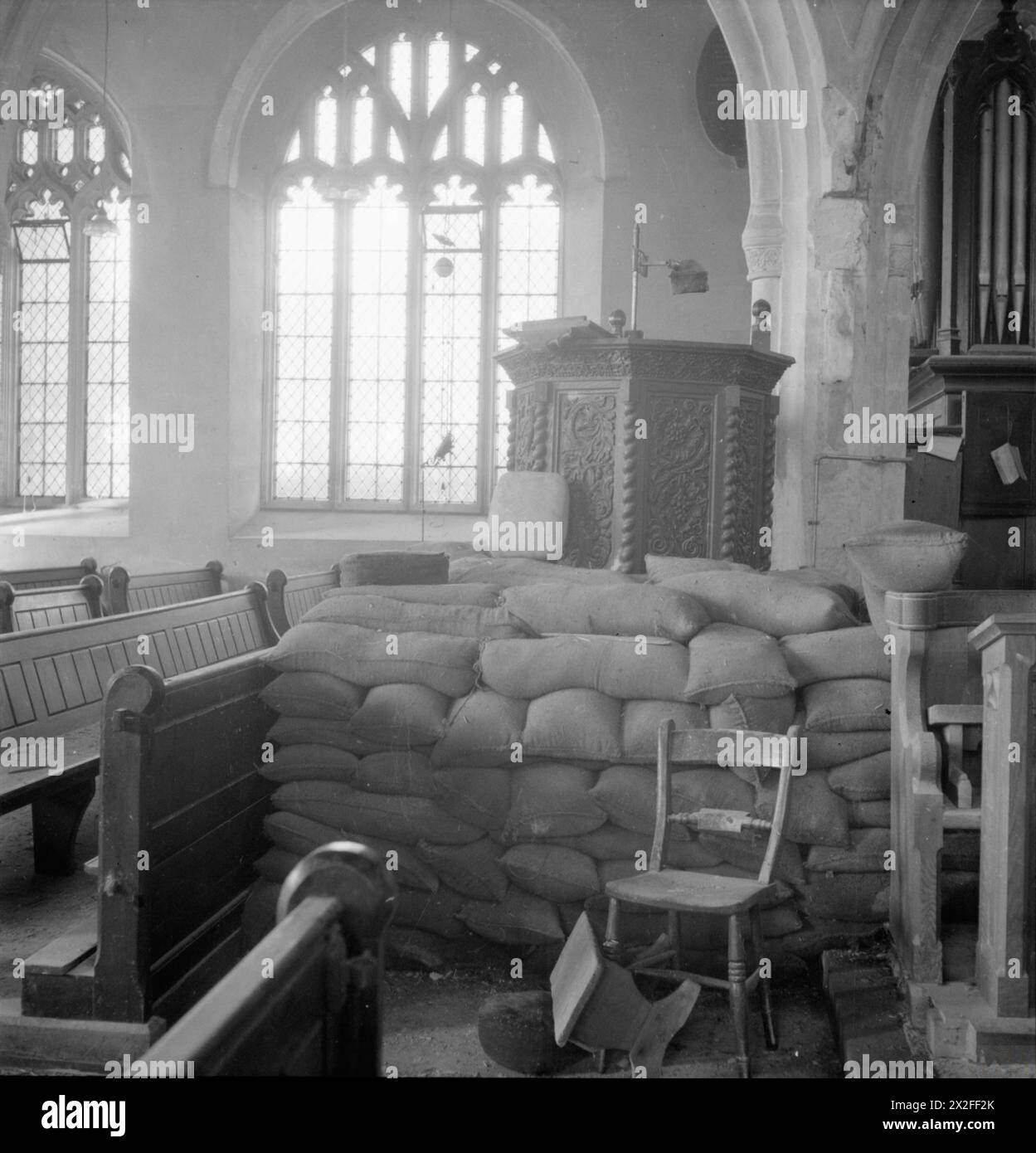 US BATTLE TRAINING AREA, DEVON, ENGLAND, UK, SEPTEMBER 1944 - A pile of ...