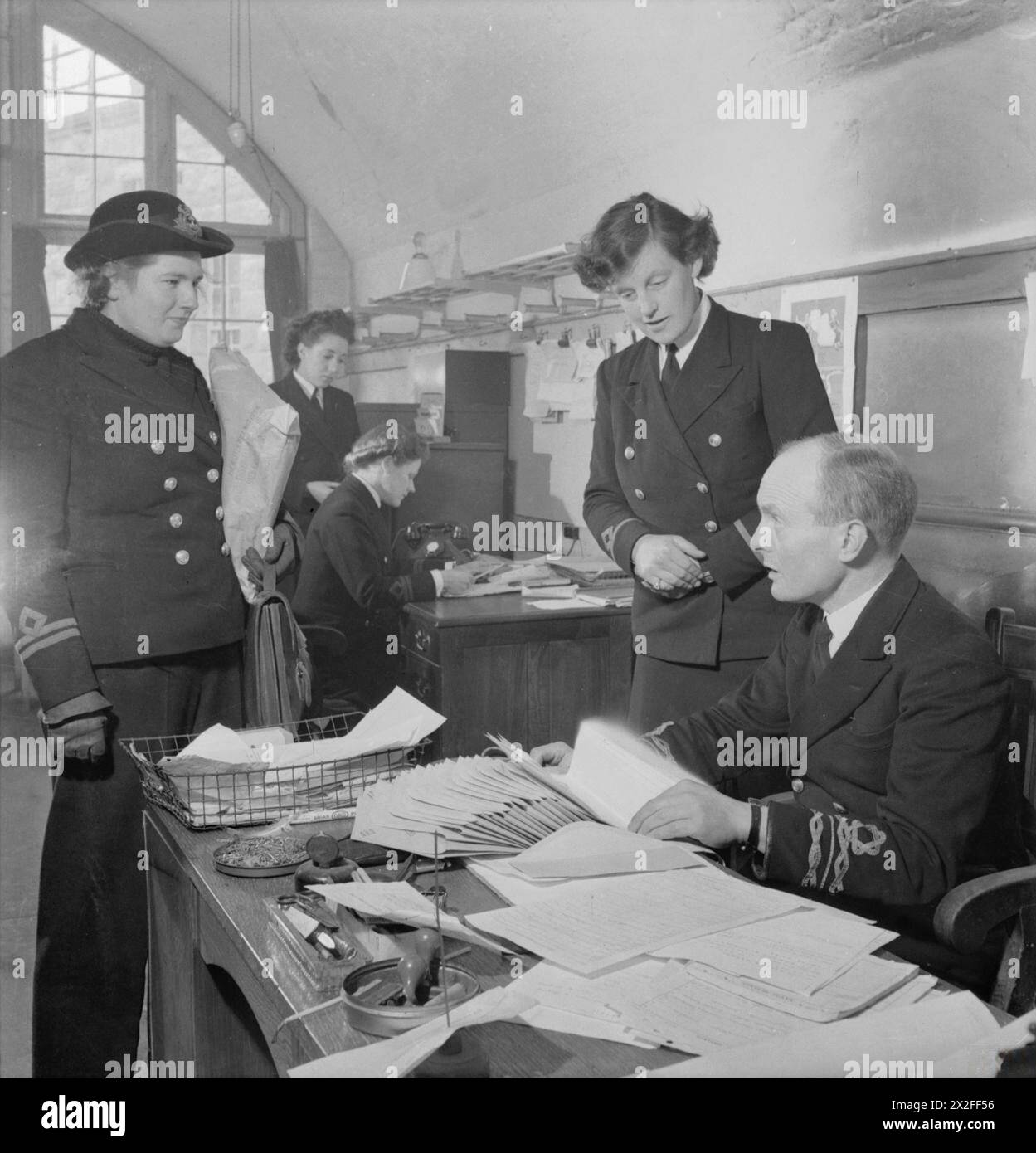 Lieutenant Commander Tetley, RNR, a Convoy Officer, discusses ...