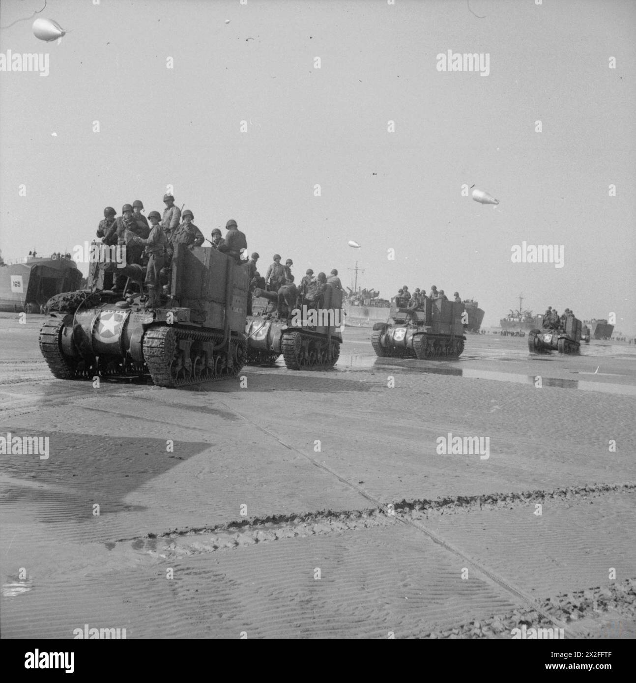 THE US ARMY IN NORMANDY 1944 - American M12 155mm GMC (Gun Motor Carriage) self-propelled guns ...