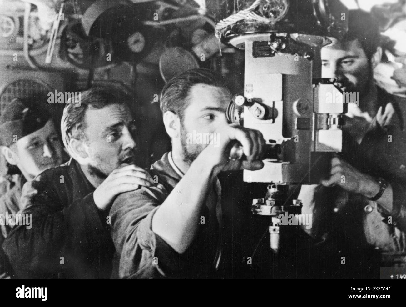 A German U-Boat commander observes a British merchant ship through his ...