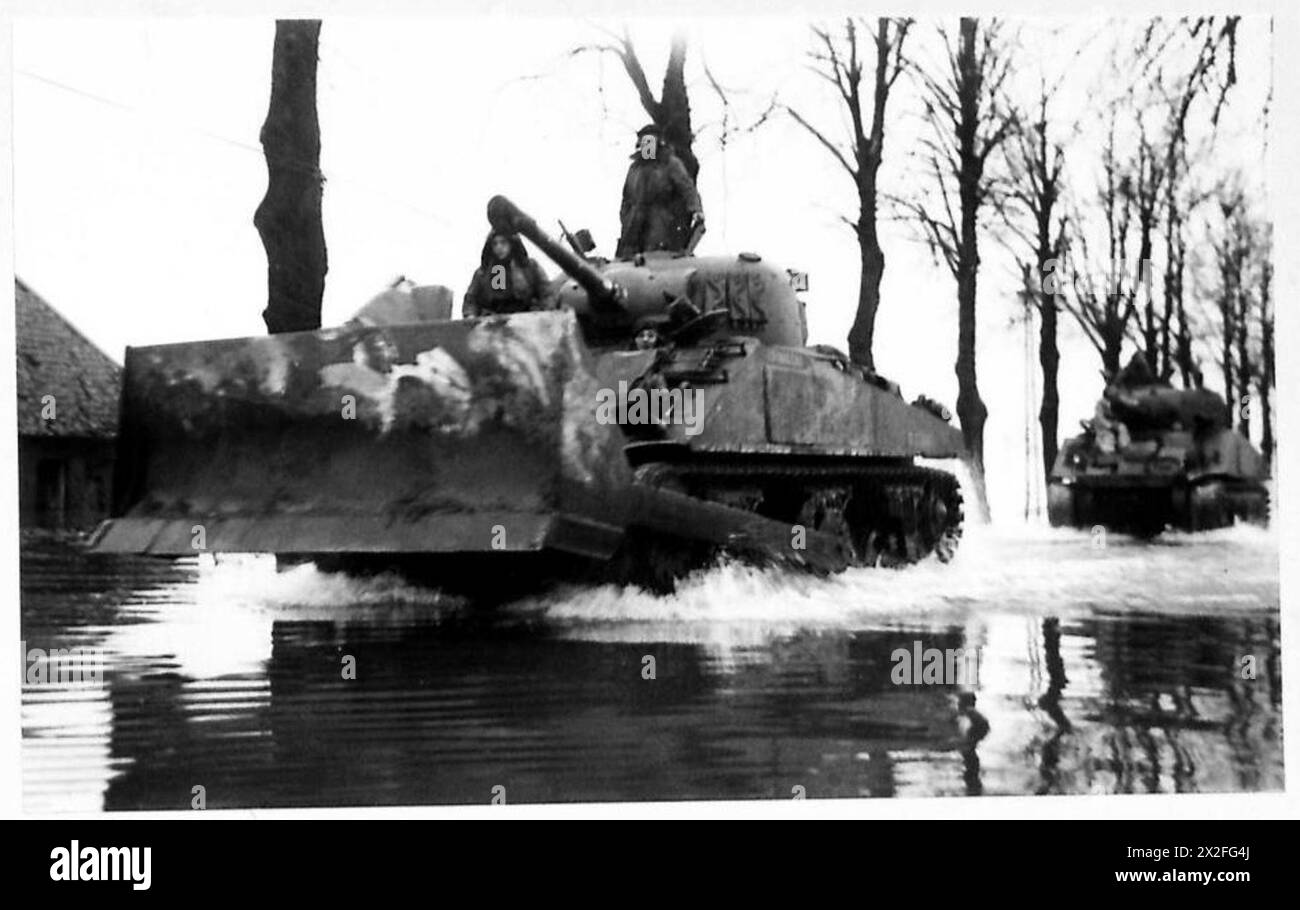 FLOODS - Sherman bulldozer tanks negotiating the floods British Army ...