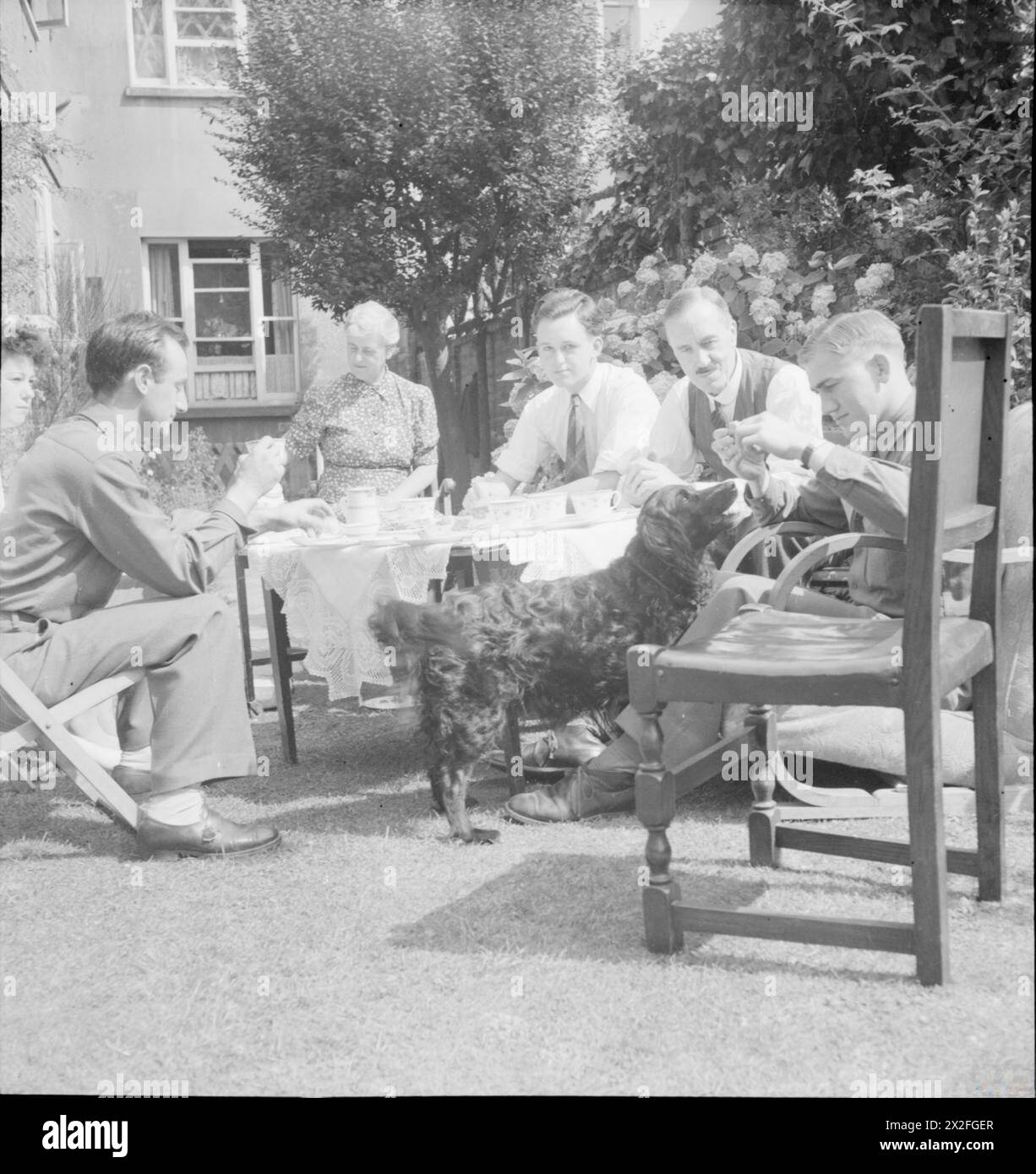 US soldiers Alfred Miraglia and Corporal John R. Jones take tea with ...