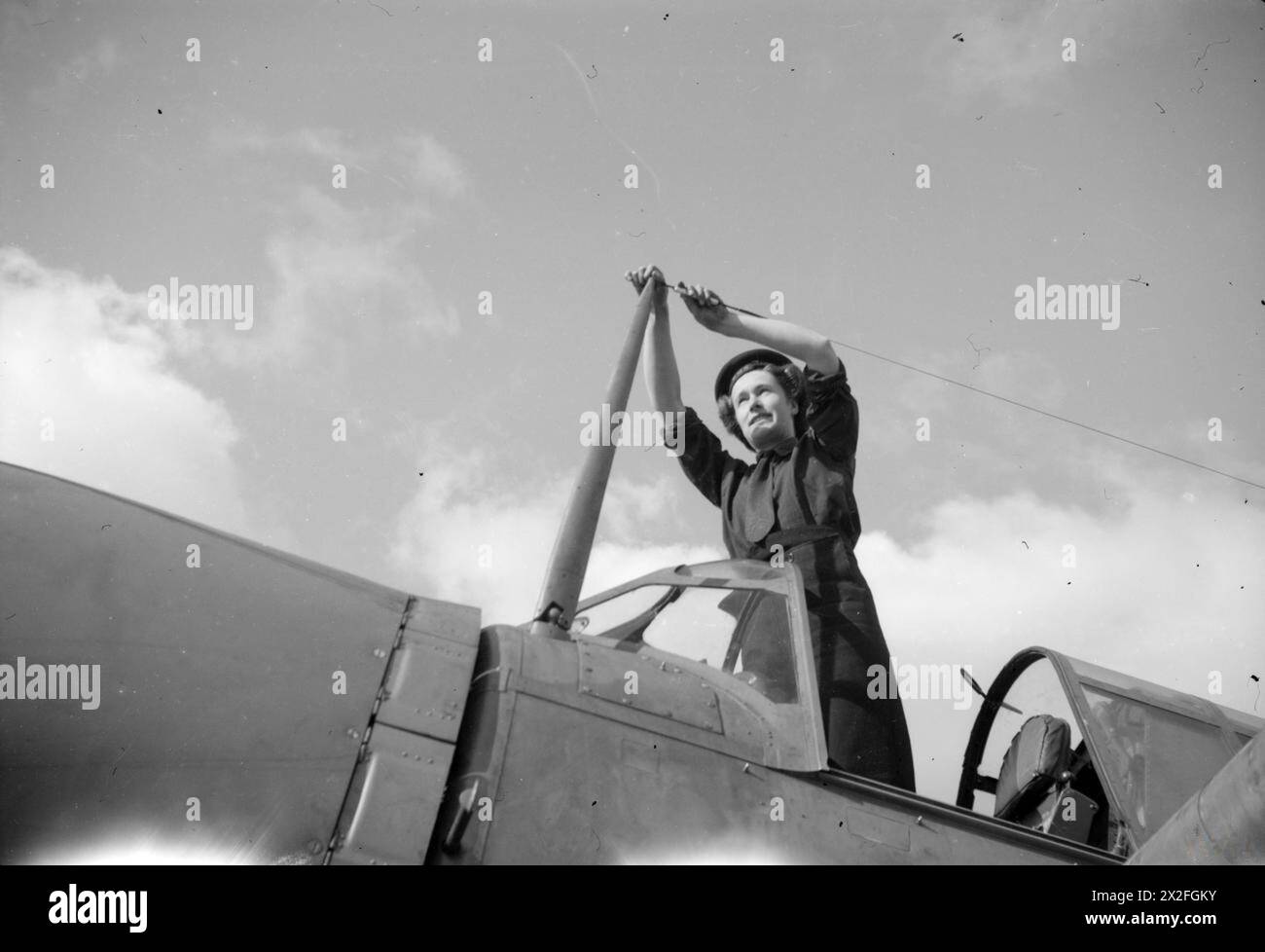Mechanic works on pilot hi-res stock photography and images - Alamy