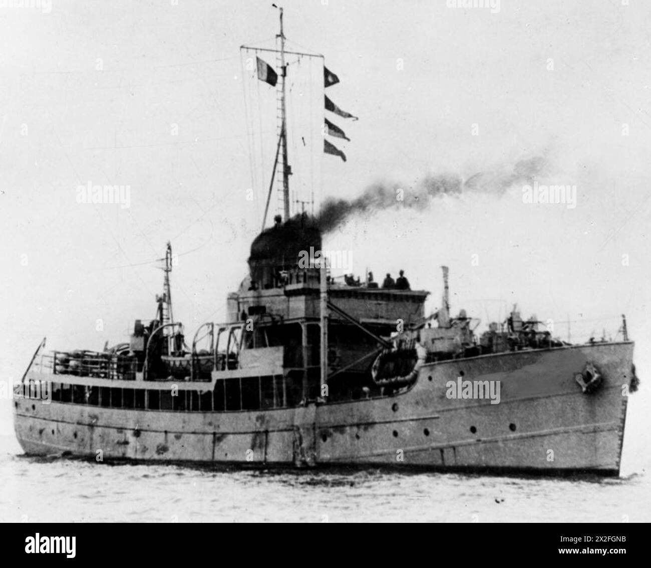 The HMS Coriolanus, a Shakespeare-class trawler, is at sea in 1944 as ...