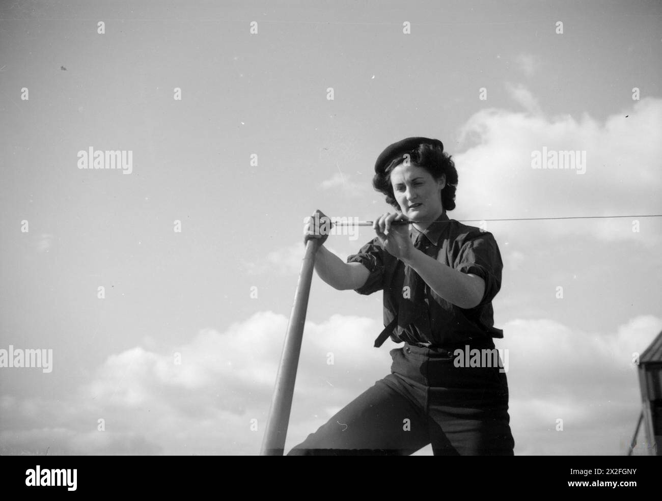 A Wren mechanic works on the aerial of a US Kingfisher amphibious ...