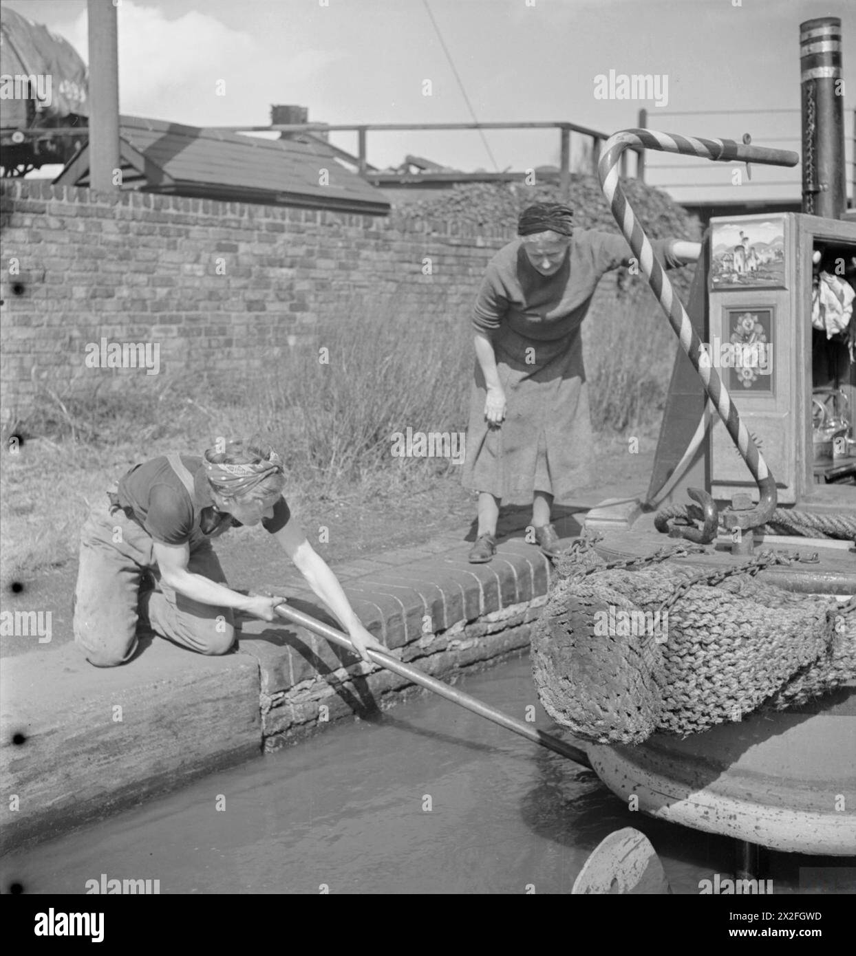 Miss March clears weeds and debris from the propeller of the canal ...