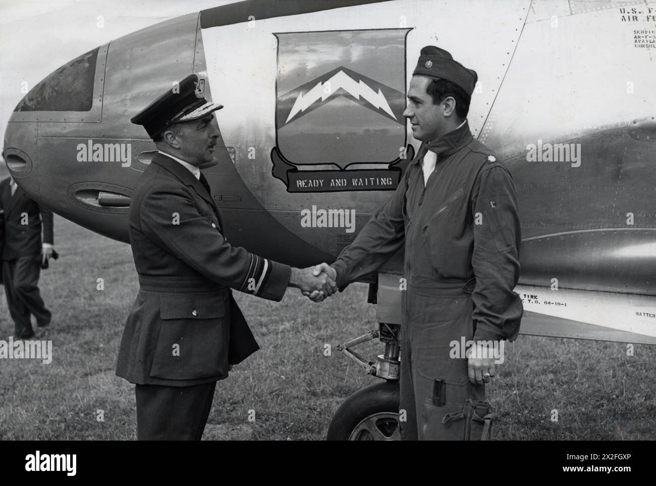 Colonel David Schilling is congratulated by an RAF officer after ...