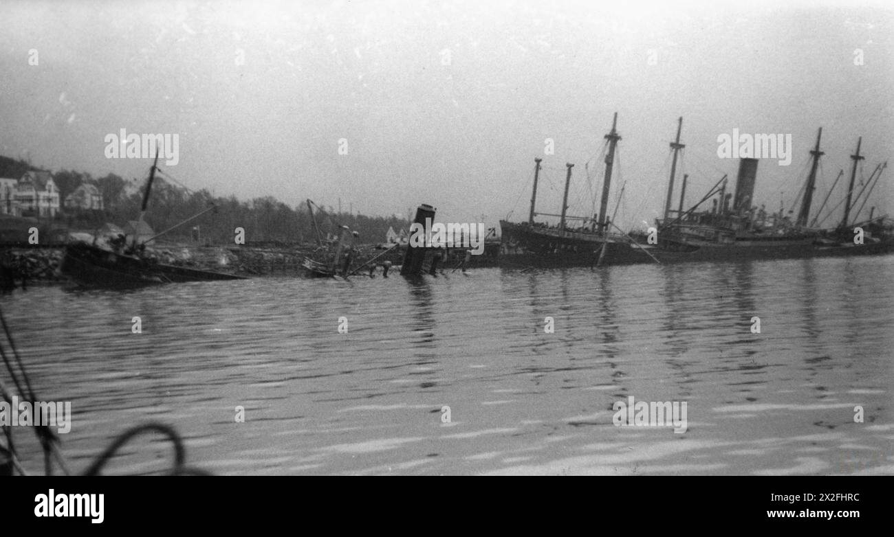 Half-submerged German merchant ships, including the LIPPE, lie wrecked ...