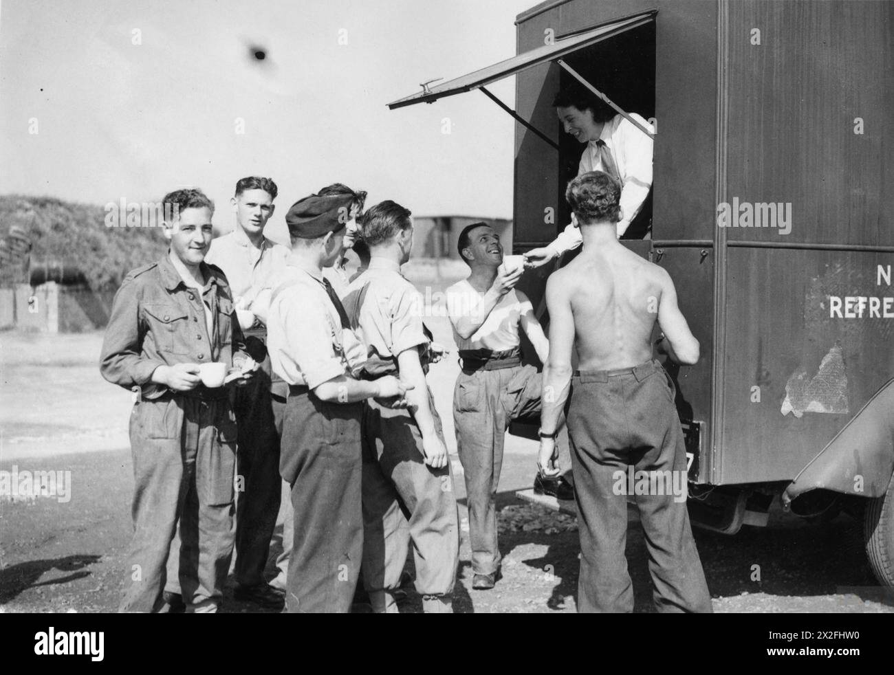 Ground mechanics of No. 303 Polish Fighter Squadron receive hot ...