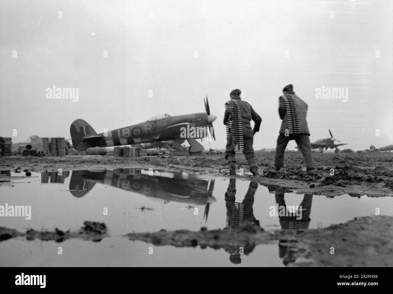 In 1944 Holland, two armourers of No. 440 Squadron, Royal Canadian Air ...