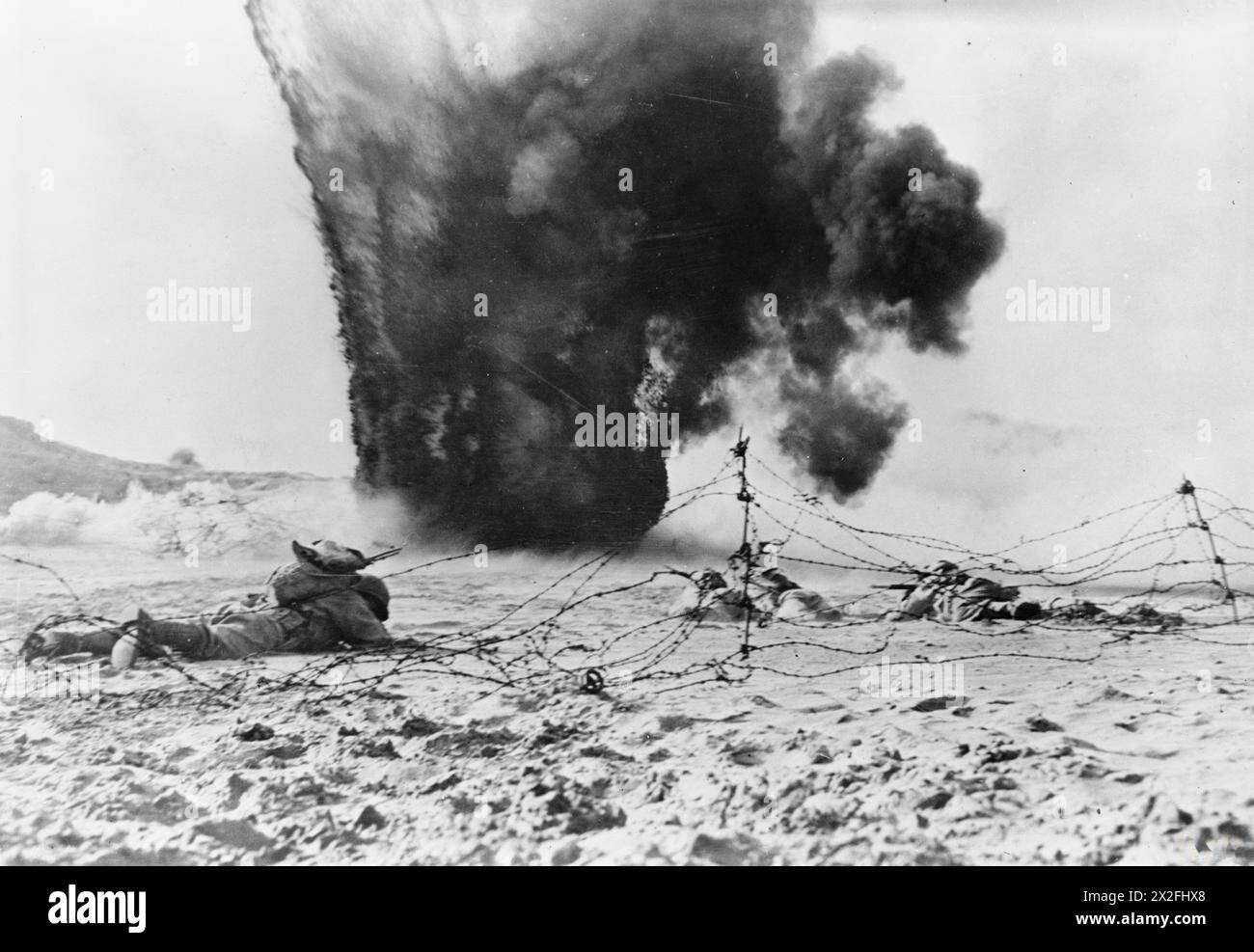 US troops take cover during a live ammunition training exercise in the ...