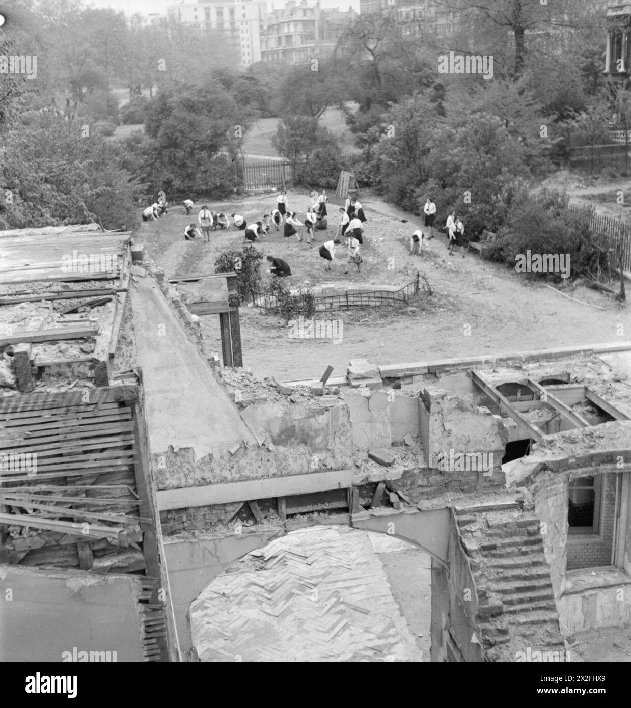 Members of the Girls Training Corps establish an allotment on a former ...