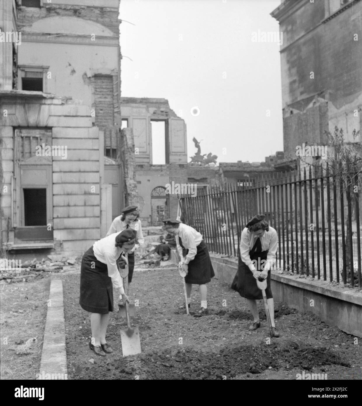 BRITAIN'S YOUTH PREPARES: GIRLS CREATE ALLOTMENTS ON BOMB SITE, LONDON ...