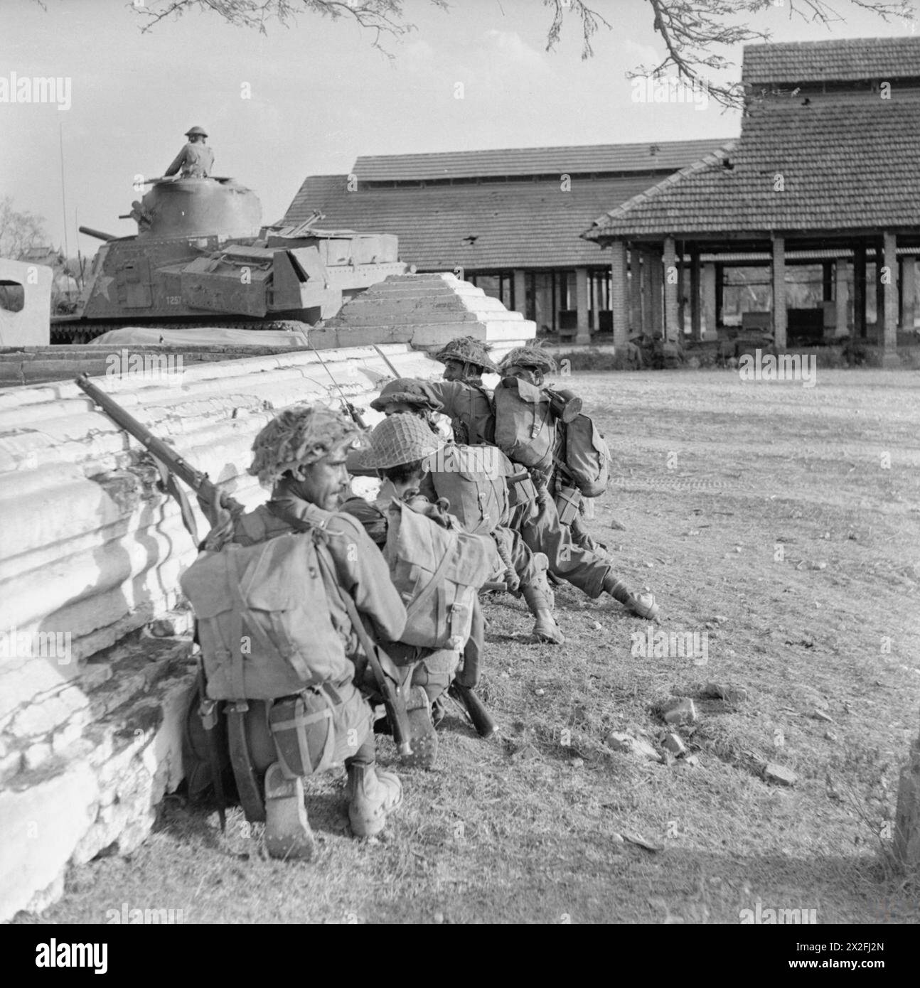 THE BRITISH ARMY IN BURMA 1945 - Troops of 19th Indian Division and a Lee tank in action during ...