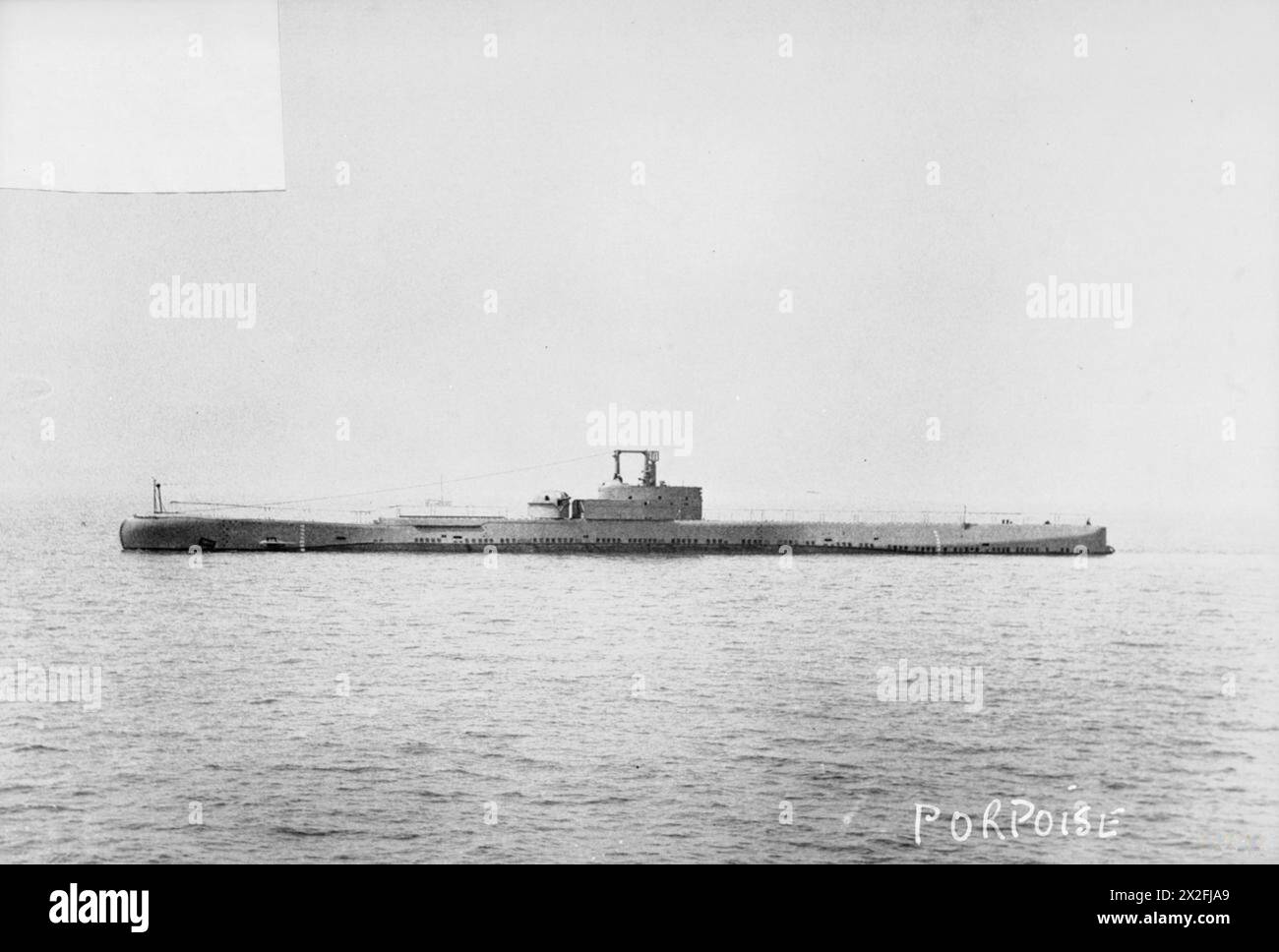 HMS Porpoise, a Royal Navy submarine, stationary in port in 1932 ...