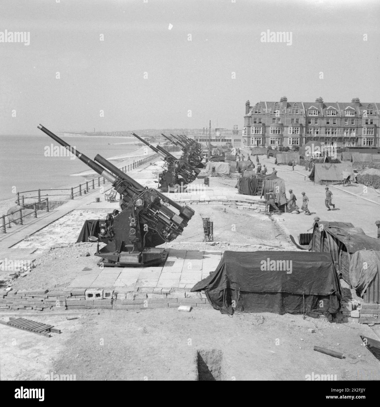 THE BRITISH ARMY IN THE UNITED KINGDOM 1939-45 - 3.7-inch anti-aircraft guns emplaced on the ...